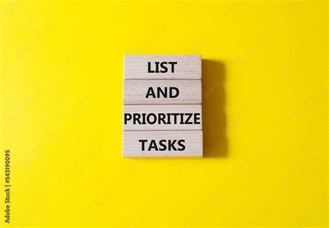 List And Prioritize Tasks Symbol Concept Words List And Prioritize Tasks On Wooden Blocks