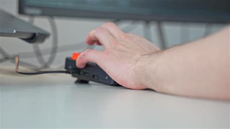 Hands Operating A Colorful Computer Keyboard Comes Into Focus As A User