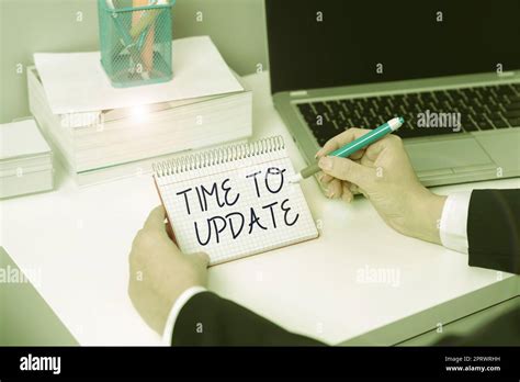 Hand Writing Sign Time To Update Word Written On The Latest