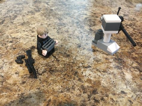 A Officer Controlling A Remote Control Turret Scrolller