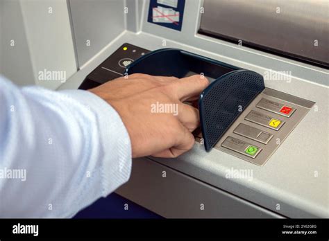 Atm Machine And Close Up Man Hand Pushing On The Pin Button Hand Entering Personal
