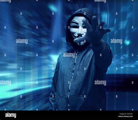 Hacker Man With Anonymous Mask Grabbing Something Over Visual