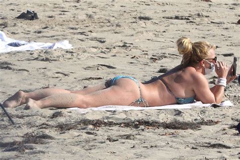 Britney Spears Sunbathing On The Beach In Malibu With Her Security