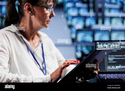 Aged System Administrator Writing Script Code In Data Center On Laptop Terminal Skillful