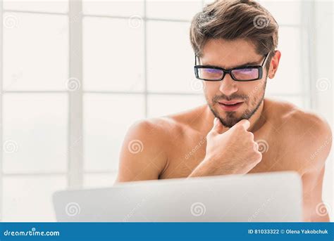 Serious Guy Working On Laptop In Bedroom Stock Photo Image Of Concentration Cheerful