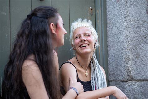 Punk Lesbian Girls Talking And Smiling Outdoors By Stocksy Contributor Luis Velasco Stocksy