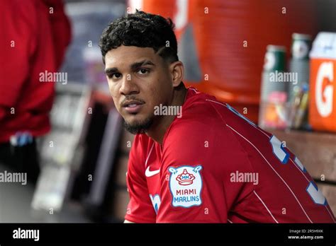 Miami Marlins Starting Pitcher Eury Perez Sits In The Dugout During A Baseball Game Against The