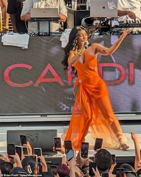 Cardi B Throws A Microphone At A Fan Who Hurls A Drink At Her Mid