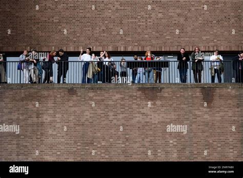 People Looking Across The River Thames From The Outside Viewing Area