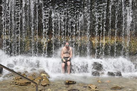 Premium Photo Full Length Of Shirtless Man Splashing Water
