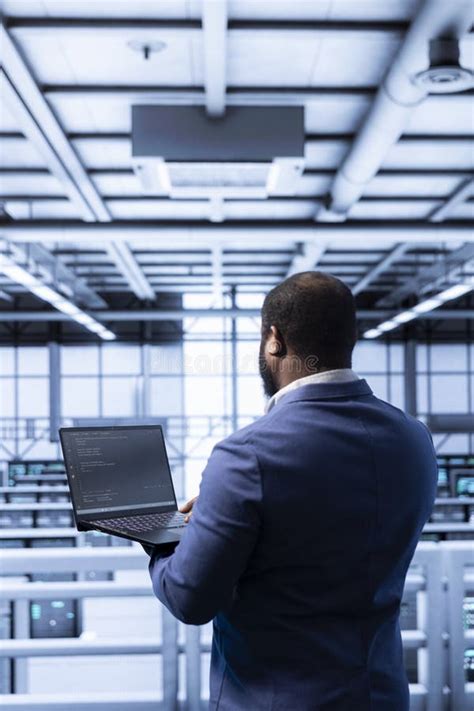 admin in data center checking rigs and hardware doing checkup stock