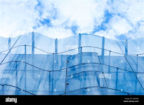 Detail Of The Wavy Glass Curtain Wall Facade Of A Nice Modern Building