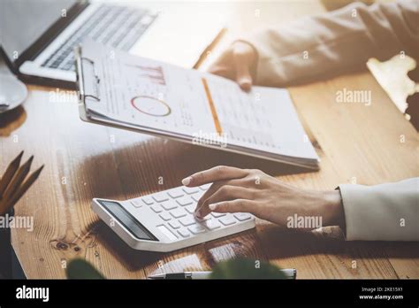 Financial Planning Marketing And Accounting Asian Woman Economist Using Calculator To