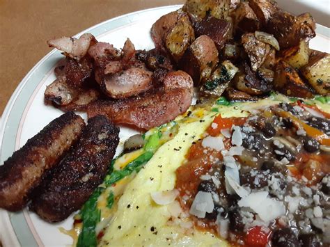 Sausage Peppered Bacon Ends Homefries And A Spinach And Cheese Omelet