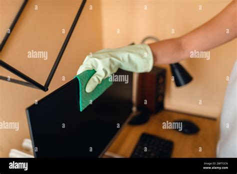 Beautiful Caucasian Woman Cleans Dust On Furniture In Room Stock Photo Alamy