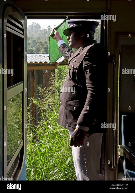 A Class S12 Mcg 928 Diesel Multiple Unit Dmu Train With The Guard Giving The Green Flag To
