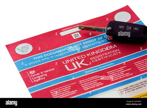 V5C Car Log Book With Electronic Key Fob Isolated On A White Background Stock Photo Alamy