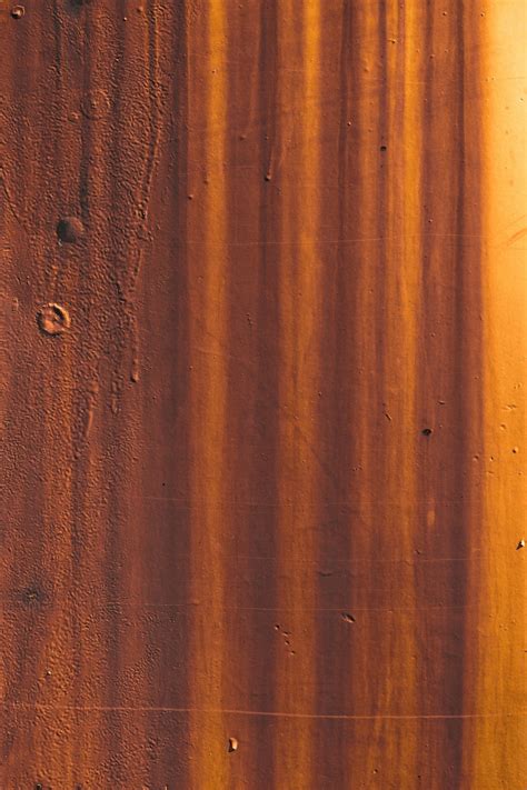 녹슨 금속 표면의 클로즈업 사진 Unsplash의 무료 갈색 이미지