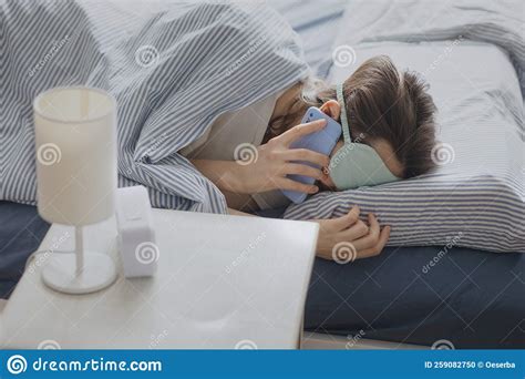 Woman In Bed With A Sleep Mask Wakes Up And Talks On The Phone An