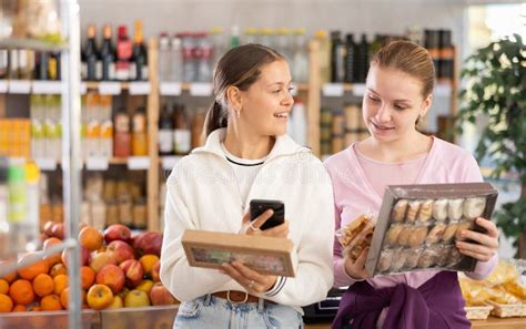 Young Women Scanning Qr Code For Sweets Stock Image Image Of Shop Products 357355097
