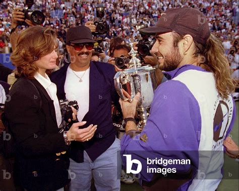 Image Of Andre Agassi Of Las Vegas Brings His Trophy To Actress