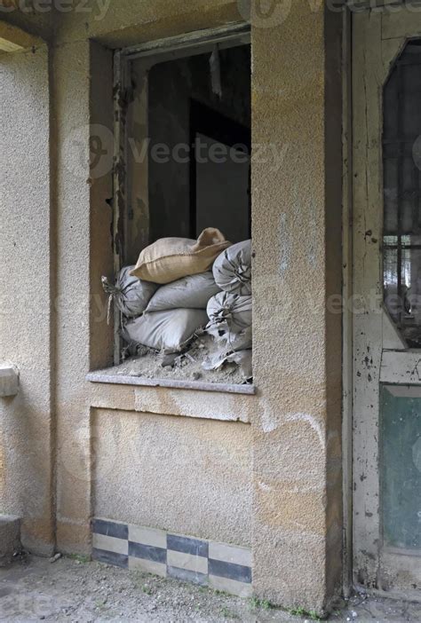 Sandbags Piled Up At A Window Of A House In The Buffer Zone Green Line