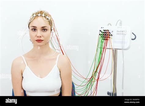 Female Patient Undergoing An Eeg Test Showcasing Modern Healthcare And Patient Comfort Perfect
