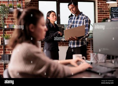 Software Developers Looking At Security Firewall On Laptop Using Html