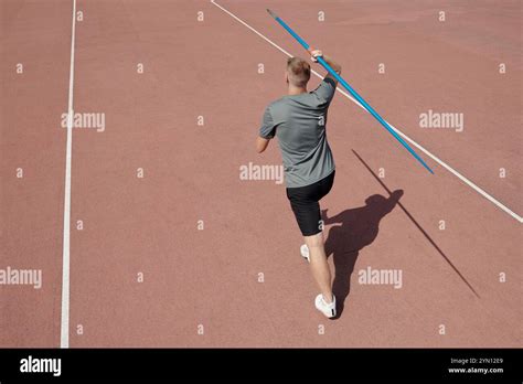 Javelin Throw Athlete Preparing For A Practice Run On Track Field During Outdoor Sports Training