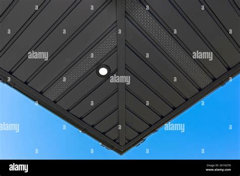 A Modern Graphite Herringbone Roof Lining Is Attached To The Trusses