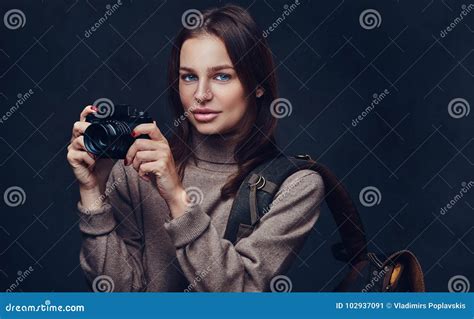 A Woman With Backpack Holds Compact Photo Camera Stock Image Image Of Camera Photographer