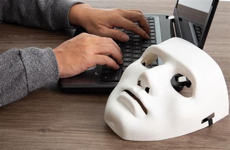 Premium Photo Thief Hacker In Mask Stealing Personal Information From
