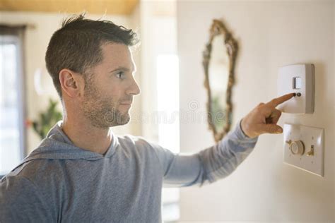 Nice Man Set The Thermostat At House Stock Photo Image Of Cold Finance 320214166