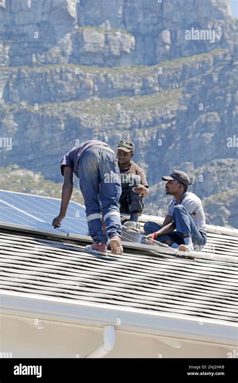 Team Installing Hybrid Grid Tied Electrical Installation Of Solar
