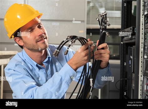 Network Engineer Preparing Structured Cabling For Data Center Stock Photo Alamy