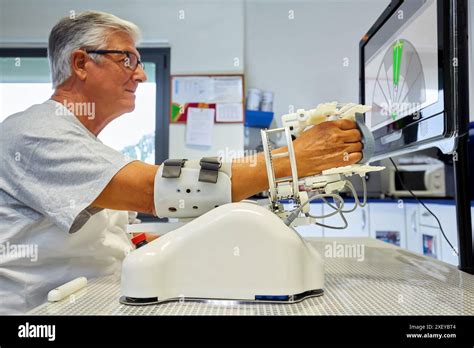 Patient With Assistive Robot For Upper Limb Rehabilitation The Robot Armassist Allows Passive