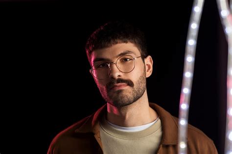 Premium Photo Man In Glasses Over Neon Lights At Nightclub