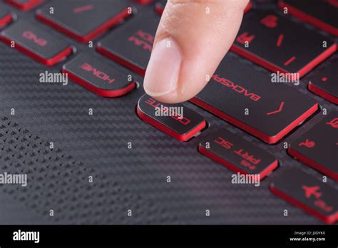 Finger Pushing Delete Button On A Laptop Keyboard Stock Photo Alamy