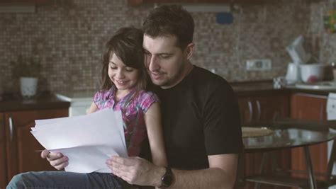Daughter Sits On Her Fathers Lap วิดีโอสต็อก ปลอดค่าลิขสิทธิ์ 100