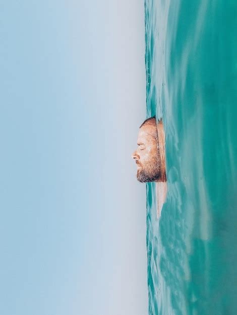 Premium Photo Man Floating In The Sea