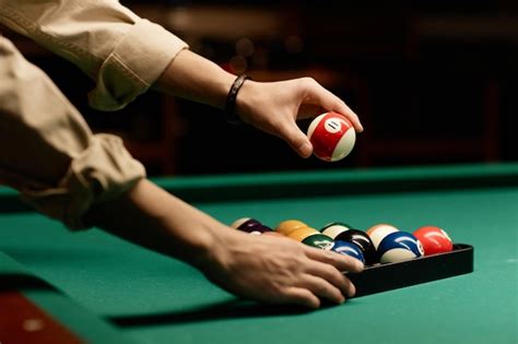 Premium Photo Male Hands Setting Up Billiard Balls On Pool Table