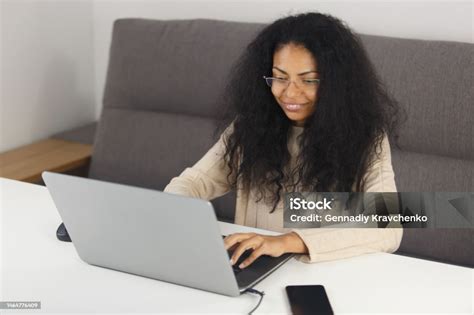 Happy Black Female Person Typing Text On Modern Notebook Keyboard Cheerful Bipoc Woman Working