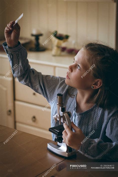Girl Experimenting Microscope Slide Microscope At Home Sitting Real Life Stock Photo