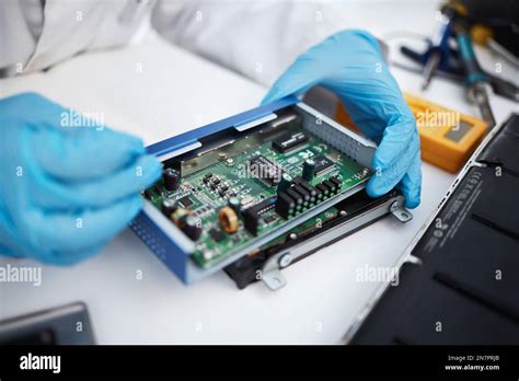 Computer Hardware Repair And Hands Of Engineer Working On Electronic
