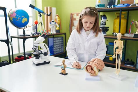 Adorable Blonde Girl Babe Writing Notes At Laboratory Classroom Stock Photo Image Of Female