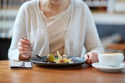Premium Photo Food New Nordic Cuisine And People Concept Woman Eating Chocolate Ice Cream