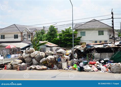 Bin Area And Thai People Dropping Waste And Working Separation Sorting