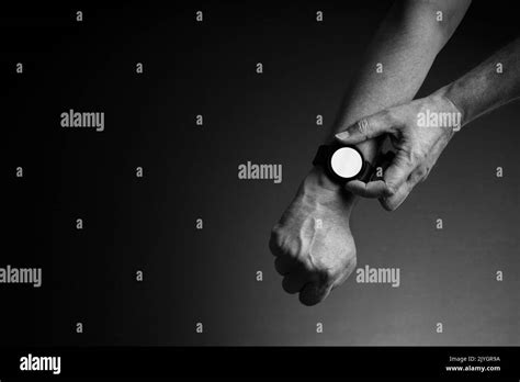 Black And White Image Of Man S Hand With Fingers Pressing Smart Watch On Wrist Displaying Blank