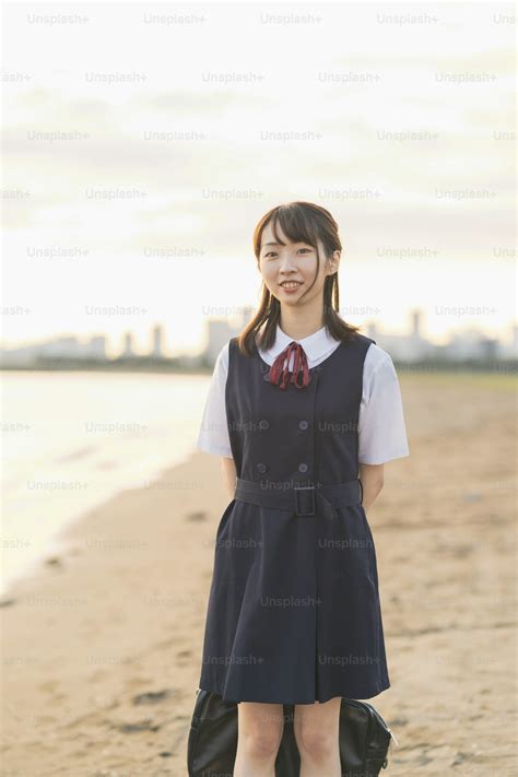 Asian Female High School Student Walking On The Beach Photo Beautiful