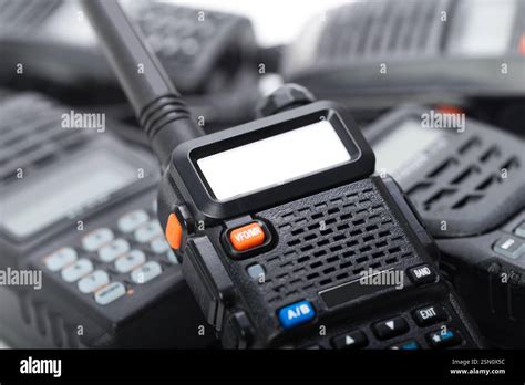 Communication Devices Stack Highlighting Handheld Radios Used For Various Activities In